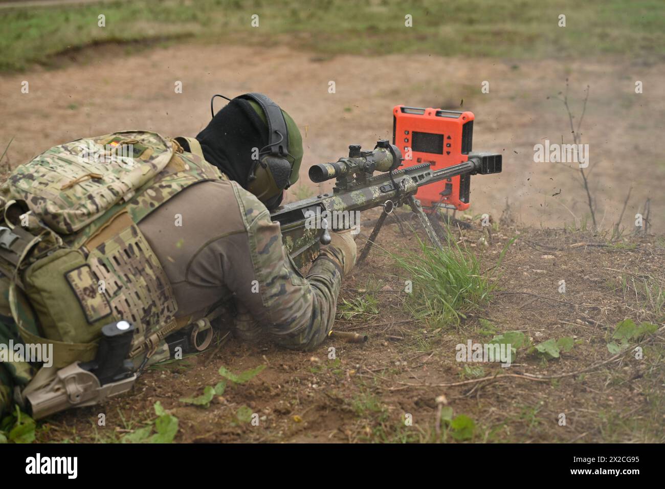 An Italian Armed Forces sniper calibrates their rifle during Saber ...