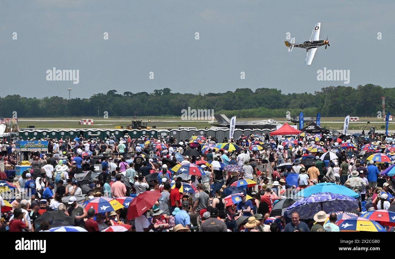A P-51 Mustang aircraft flys over a crowd during the Charleston Airshow ...