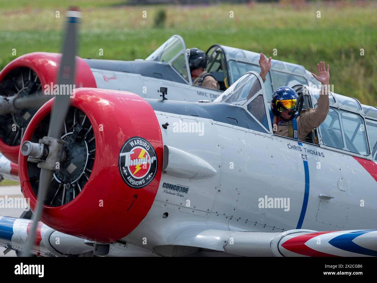 A P-51 Mustang aircraft pilot waves to the crowd after landing at the ...