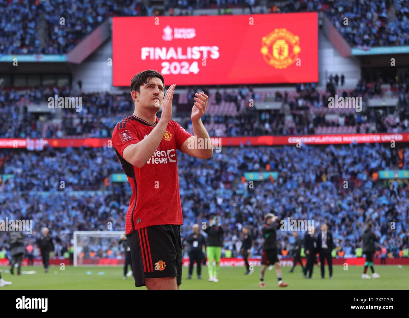 London, UK. 21st Apr, 2024. Harry Maguire (MU) applauds the fans at the ...