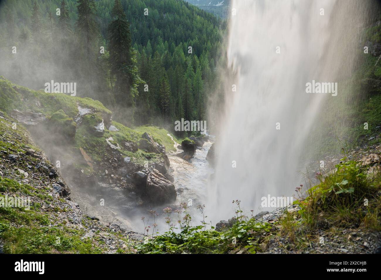 waterfall flow.Streams of water crash on rocks and boulders. stormy ...