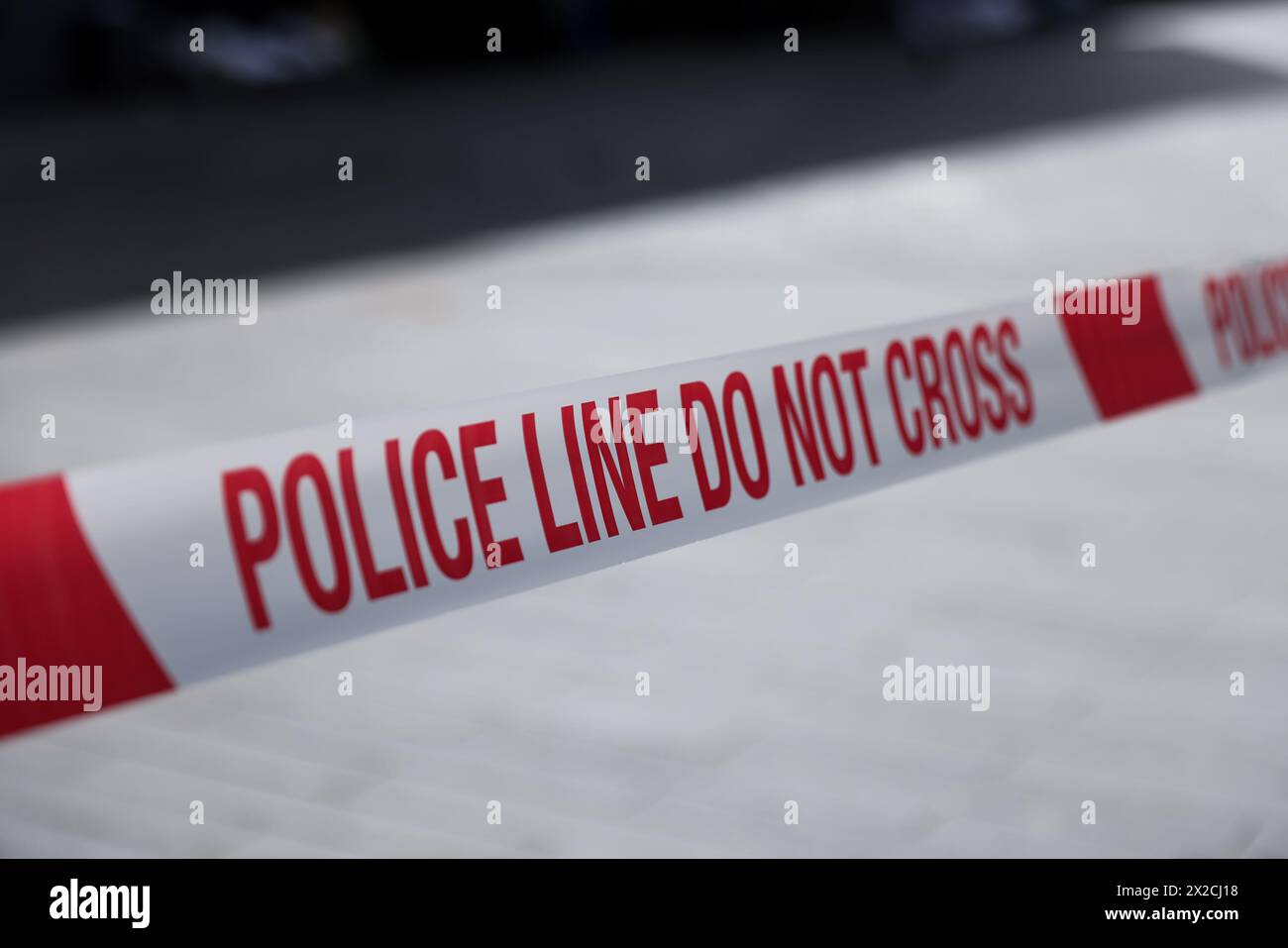 Police tape is seen at a crime scene in London Stock Photo - Alamy
