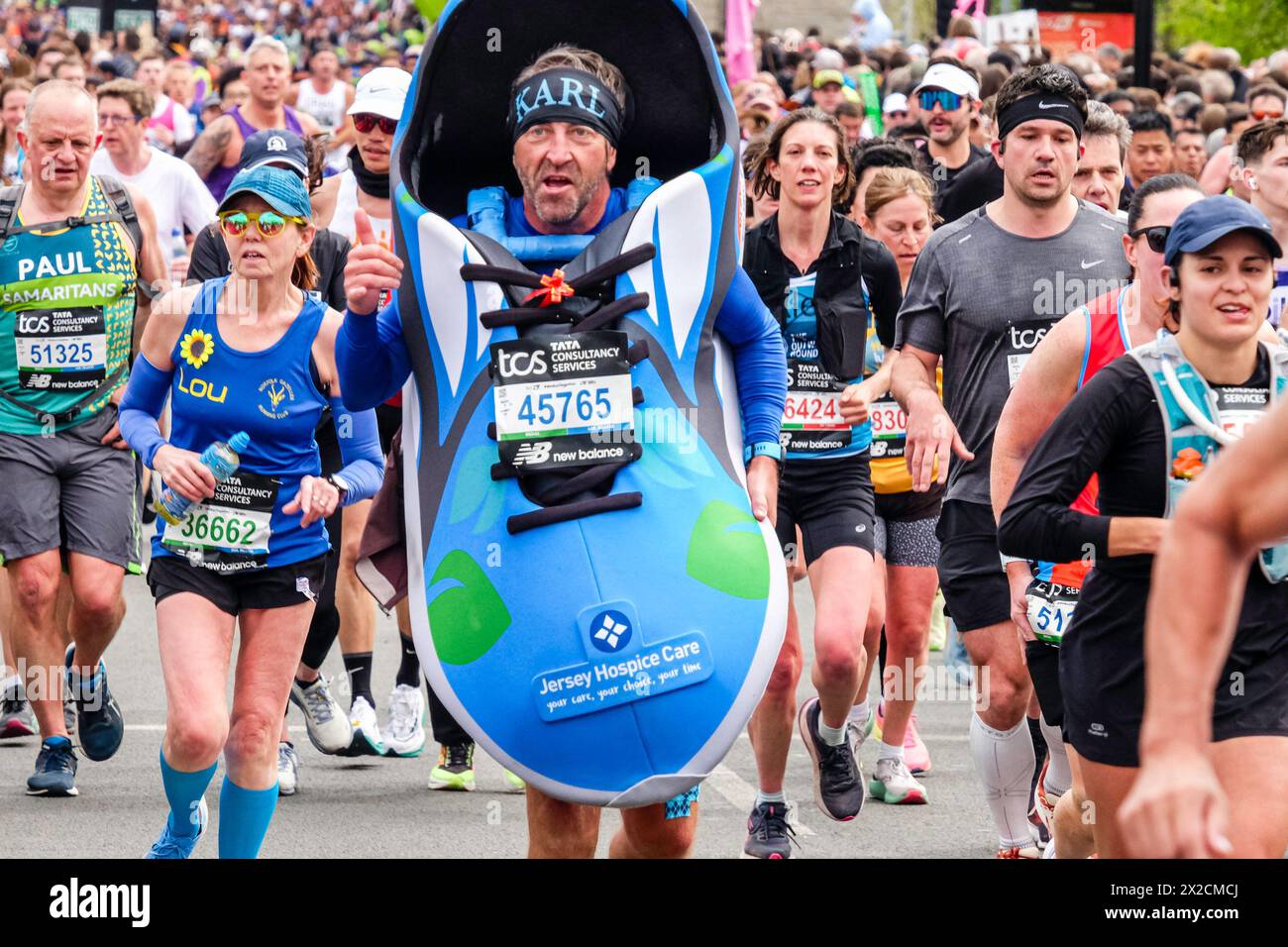 Runner in shoe costume running in aid of Jersey Hospice Care charity on ...