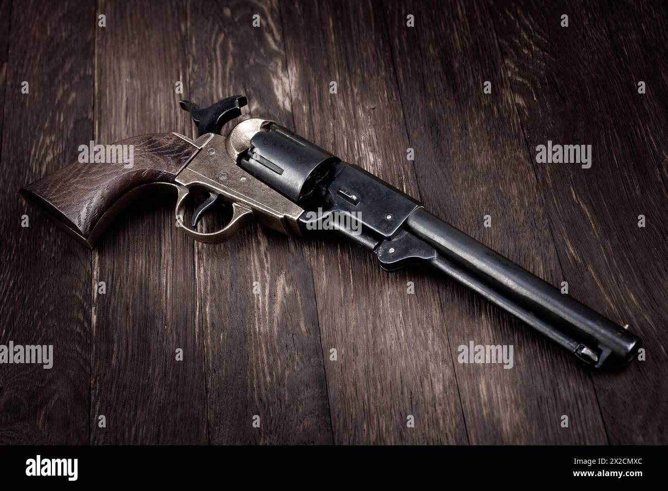 Old West gun. Percussion Army Revolver on wooden table Stock Photo - Alamy