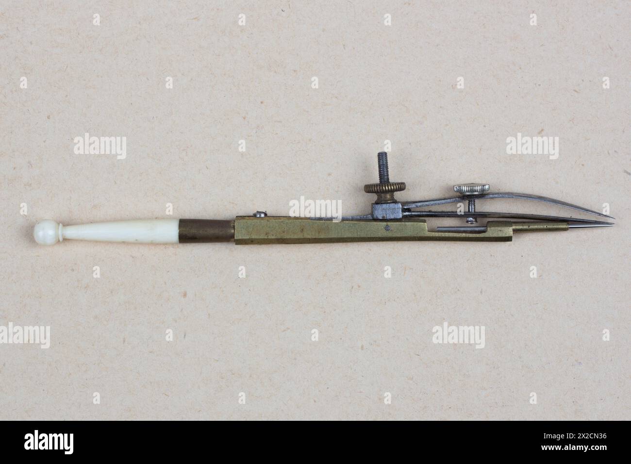 Vintage retro ruling pen on paper background Stock Photo - Alamy