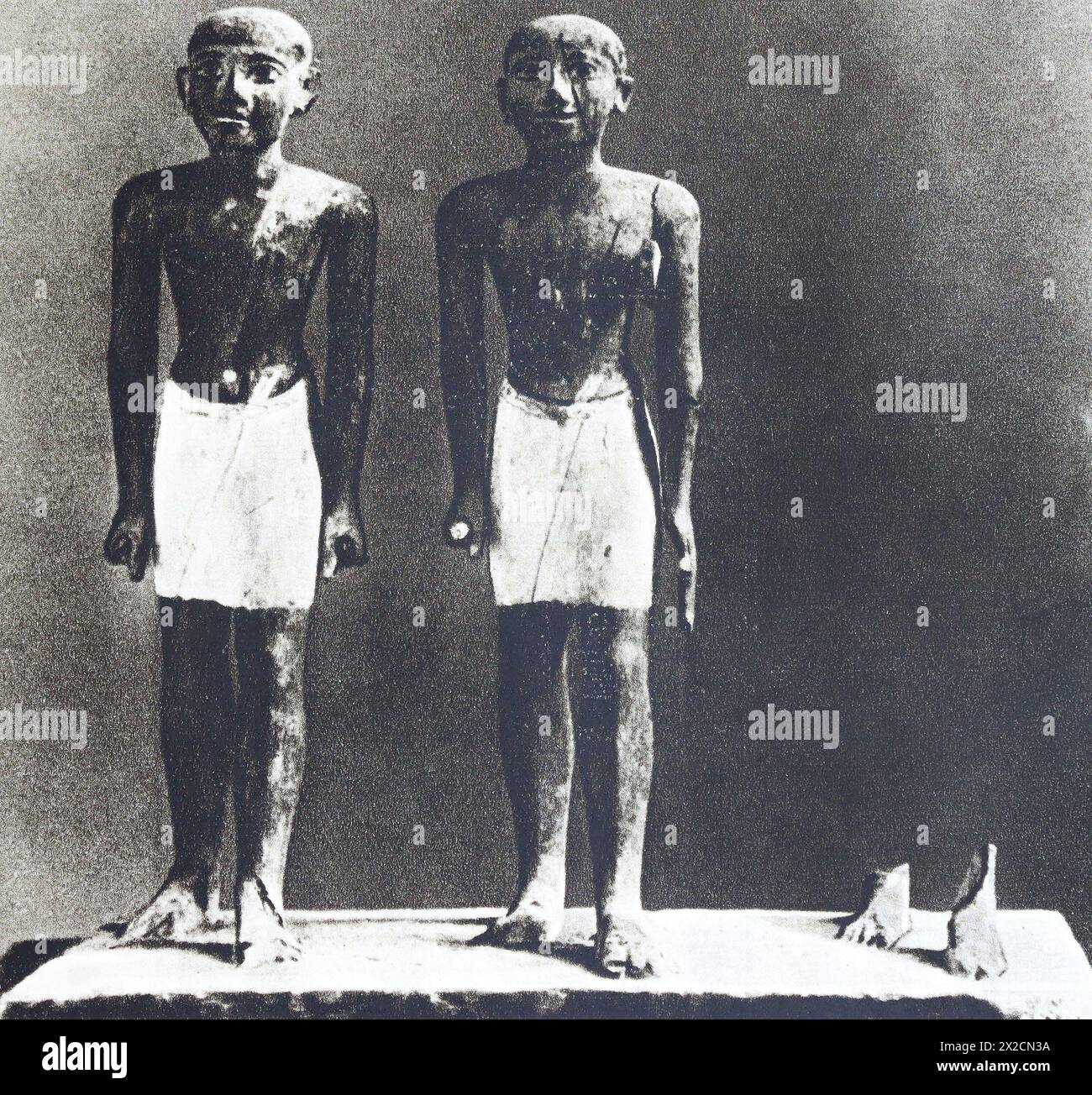 Ancient Egyptian figurines of scribes armed with sticks and overseeing ...