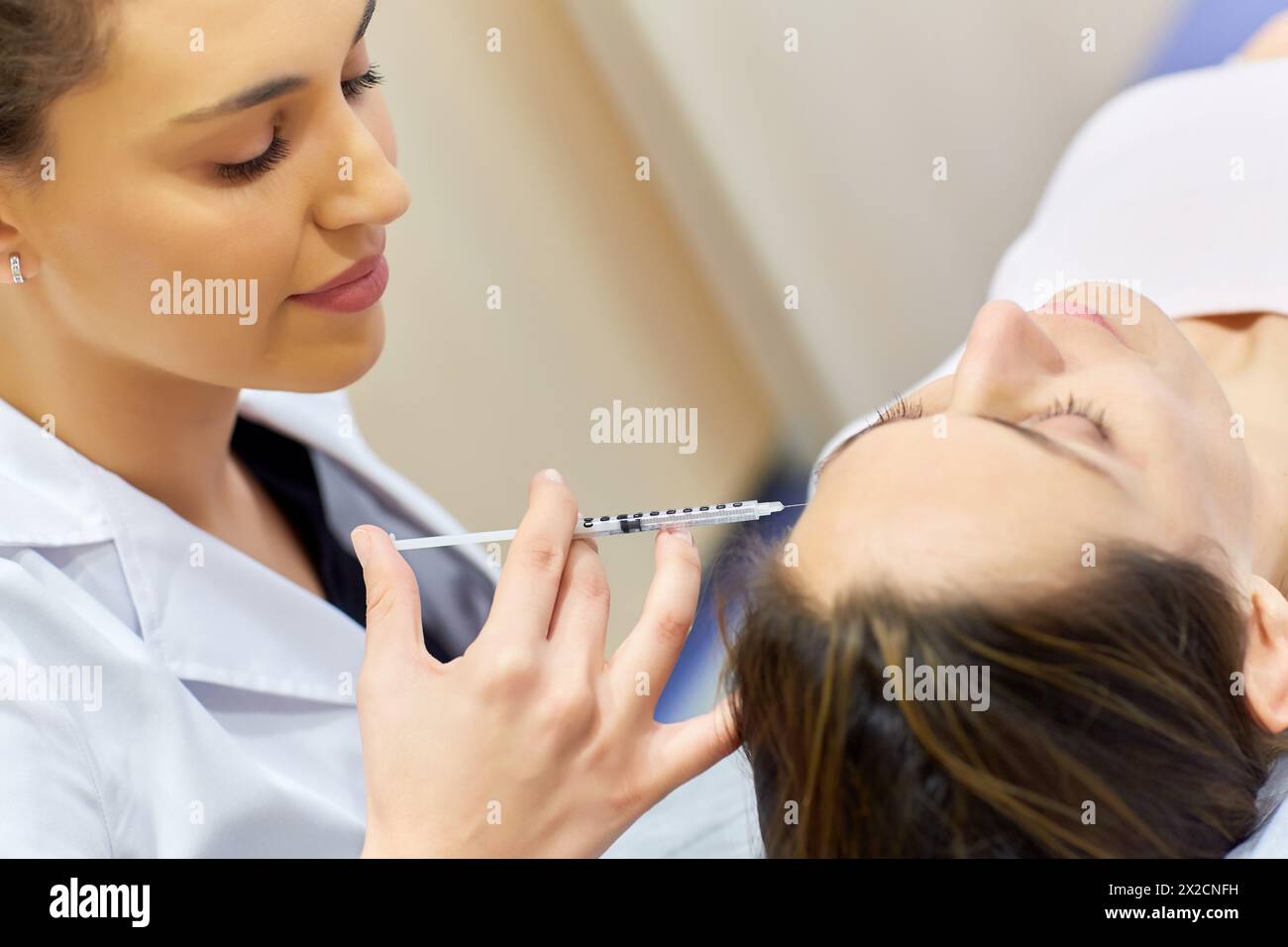 Syringe. Botox, cosmetic medicine. Botulinum toxin treatment involves ...