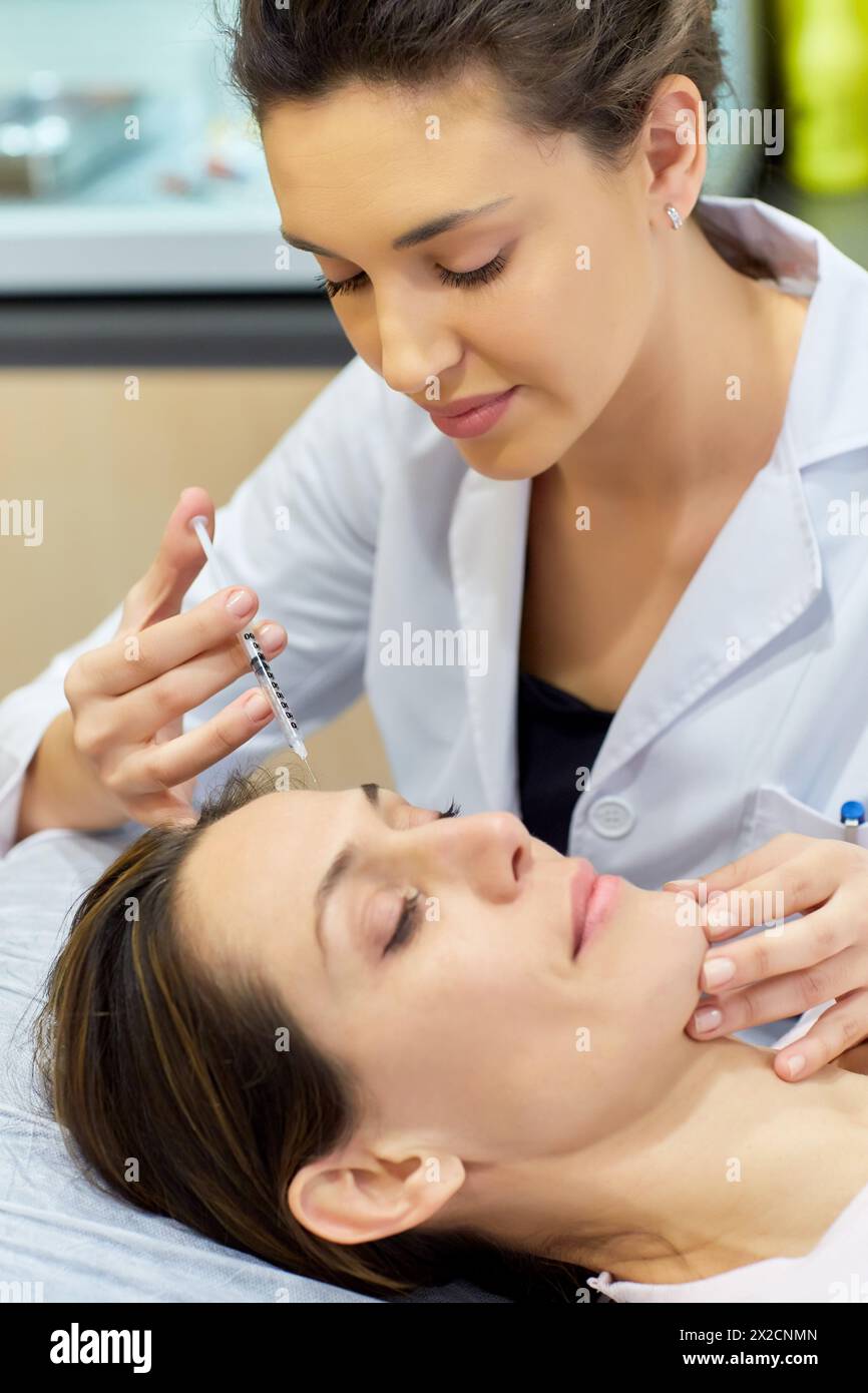 Syringe. Botox, cosmetic medicine. Botulinum toxin treatment involves ...