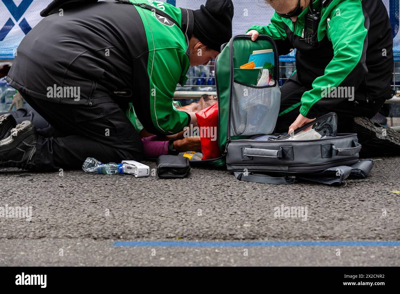 London, UK. 21st Apr, 2024. Milkesa Mengesha collapses at 39 km marker ...