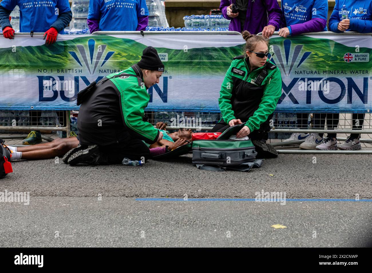 London, UK. 21st Apr, 2024. Milkesa Mengesha collapses at 39 km marker ...