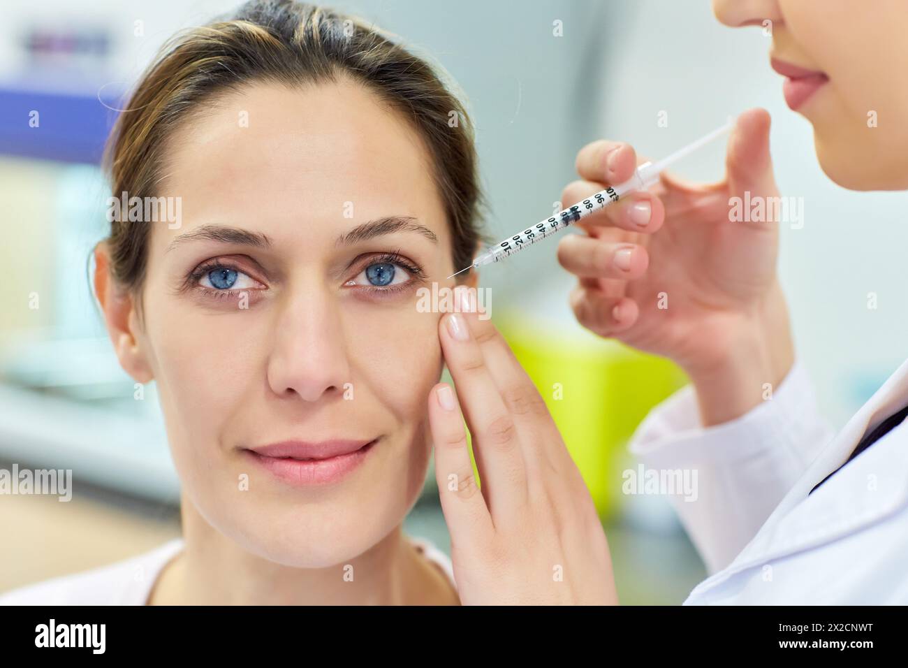 Syringe. Botox, cosmetic medicine. Botulinum toxin treatment involves ...