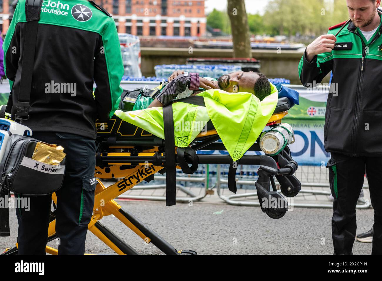 London, UK. 21st Apr, 2024. Milkesa Mengesha collapses at 39 km marker ...