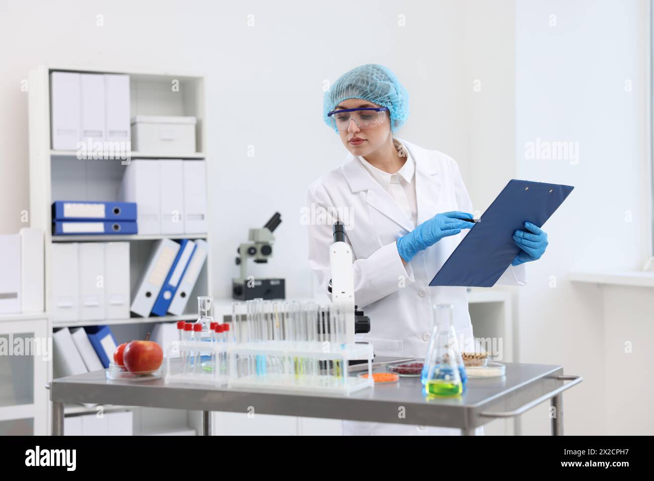 Quality control. Food inspector checking safety of products in ...