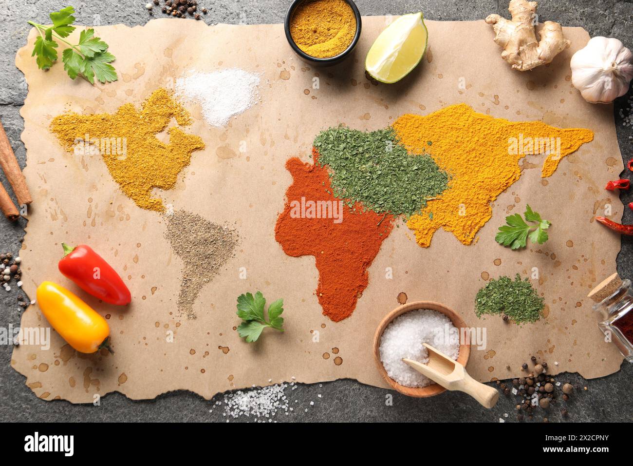 World map of different spices and products on grey table, top view ...