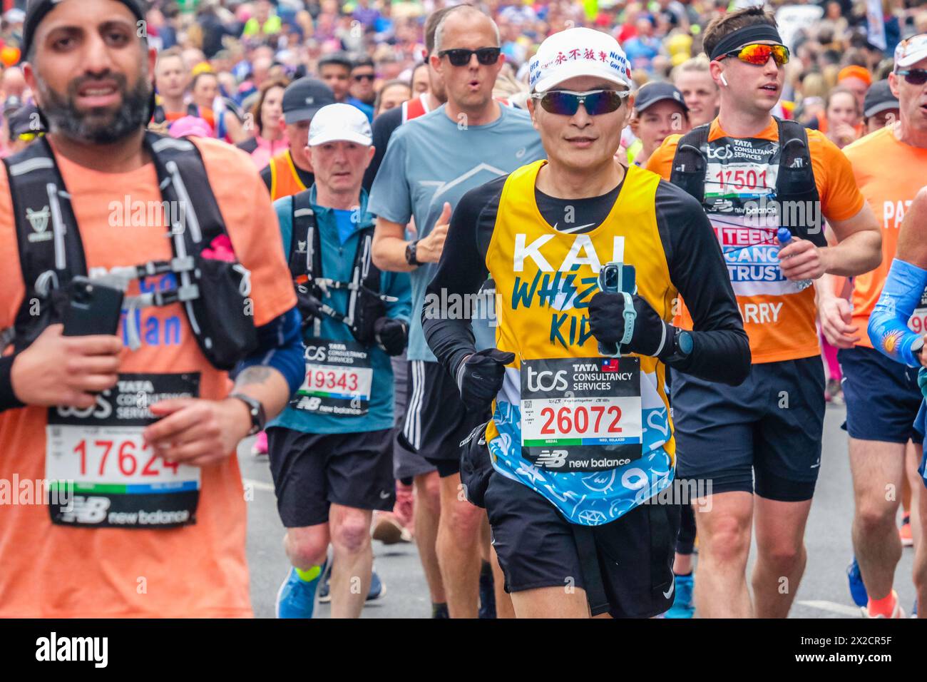 Runner on route of London Marathon 2024 running in aid of Whizz Kids ...
