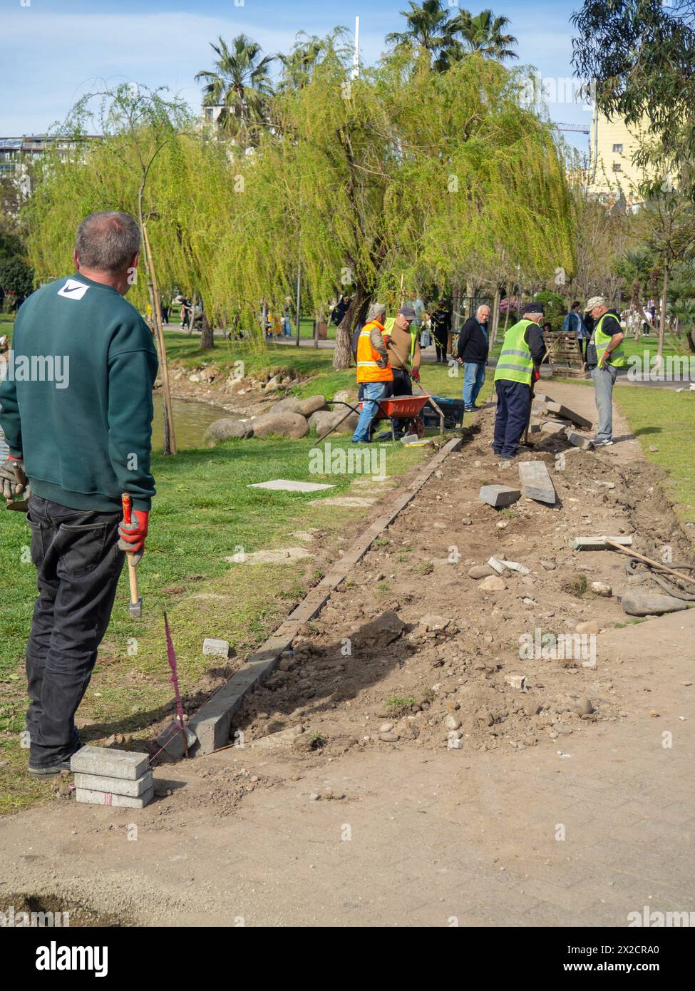 Batumi, Georgia. 04.16.2024 Workers are making a pedestrian path. Lay ...