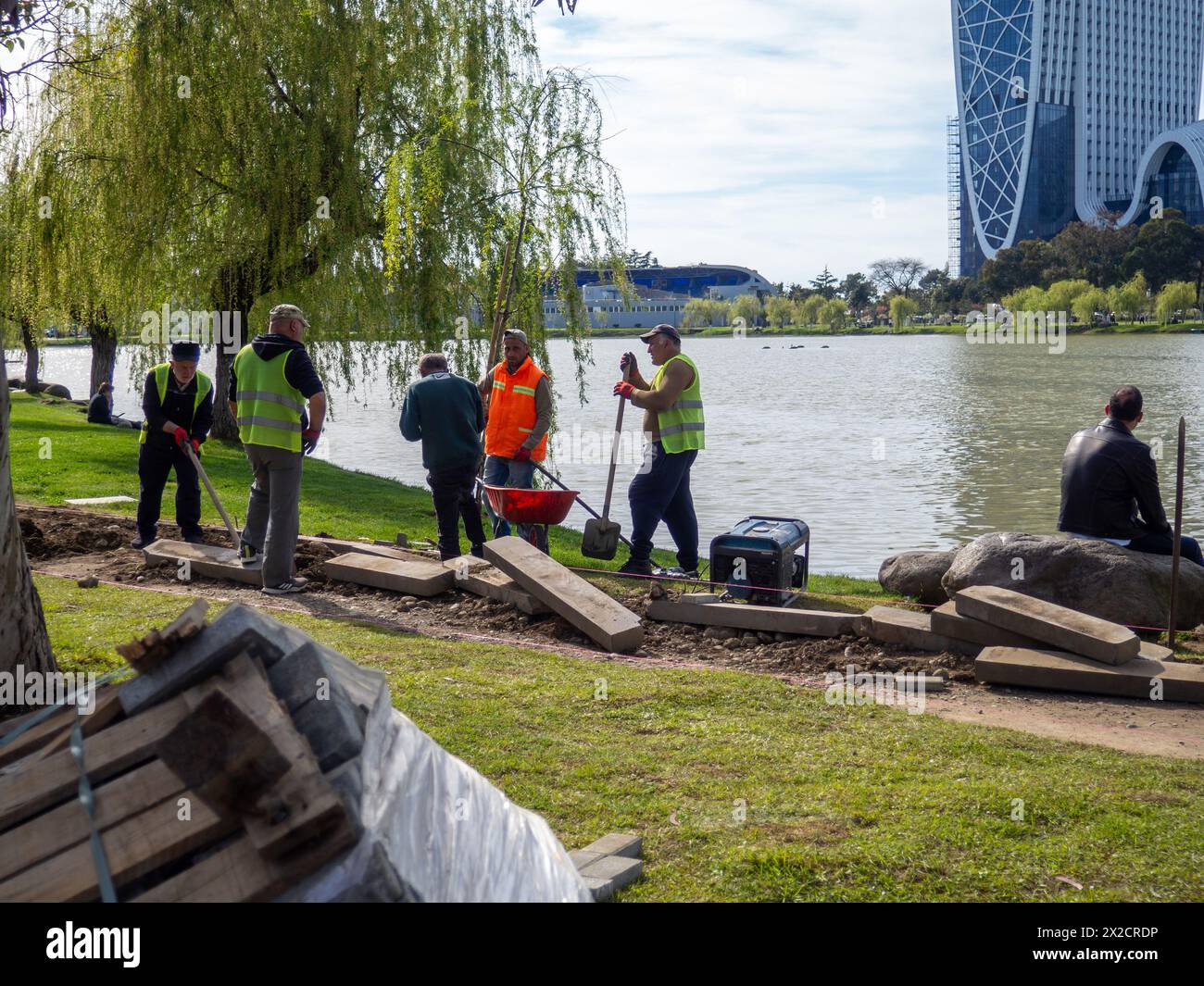 Batumi, Georgia. 04.16.2024 Workers are making a pedestrian path. Lay ...