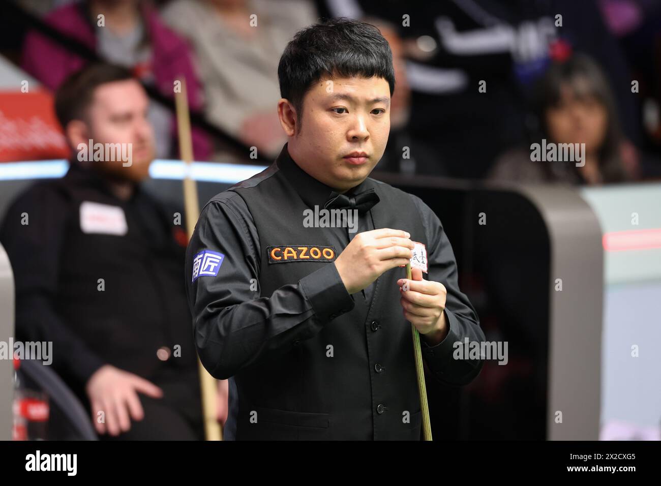 Sheffield, Britain. 21st Apr, 2024. Zhang Anda of China reacts during ...