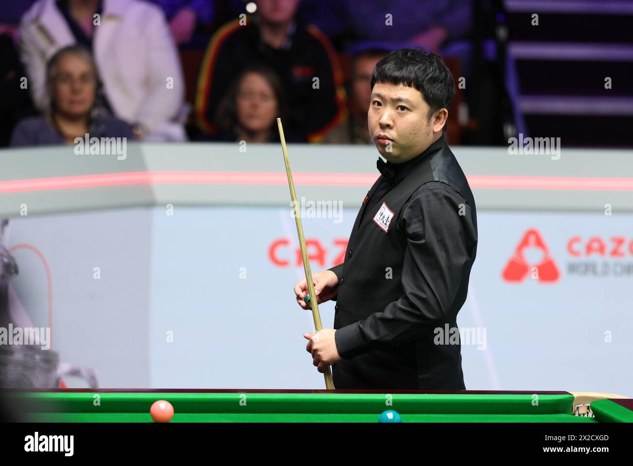 Sheffield, Britain. 21st Apr, 2024. Zhang Anda of China reacts during ...