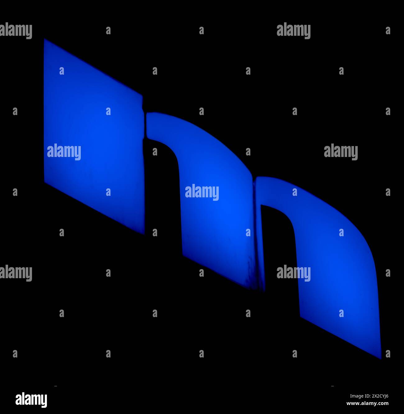 Electric blue 'm' letter flows against the black, embodying a sense of ...