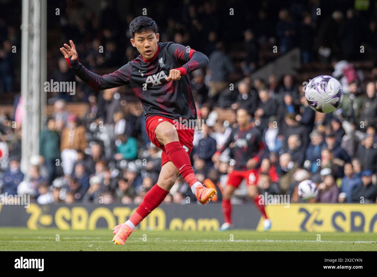 Liverpool player Wataru Endo warming up before the Premier League match ...