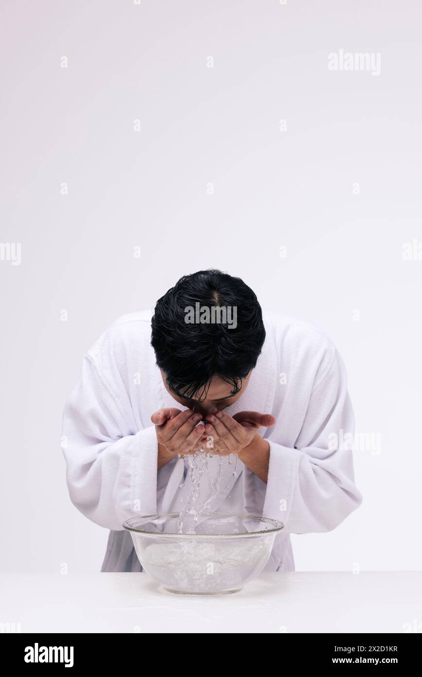 Man washing face asian hi-res stock photography and images - Alamy
