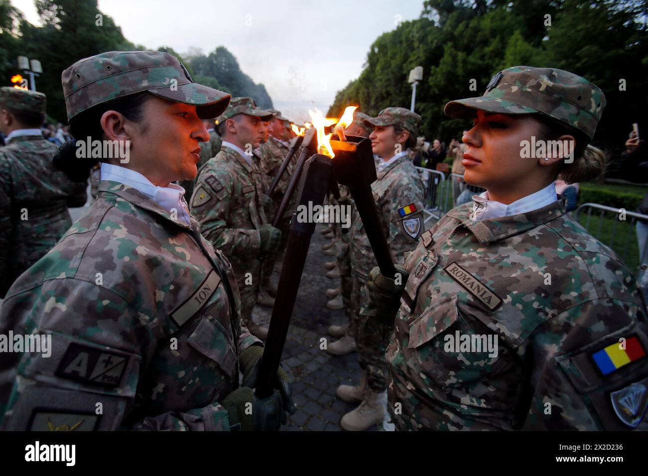 Bucharest, Romania. 21st Apr, 2024. Soldiers light torches before a ...