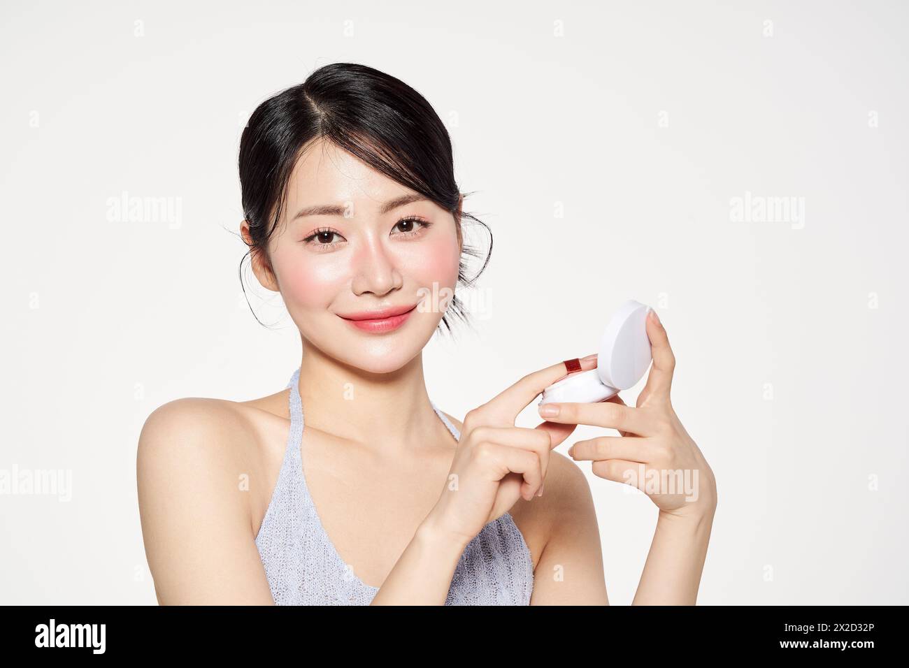 Woman tapping face hi-res stock photography and images - Alamy