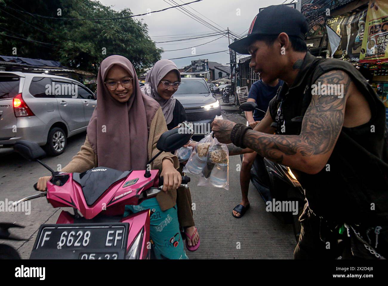Members of the punk community in Bogor, West Java, Indonesia, give food ...