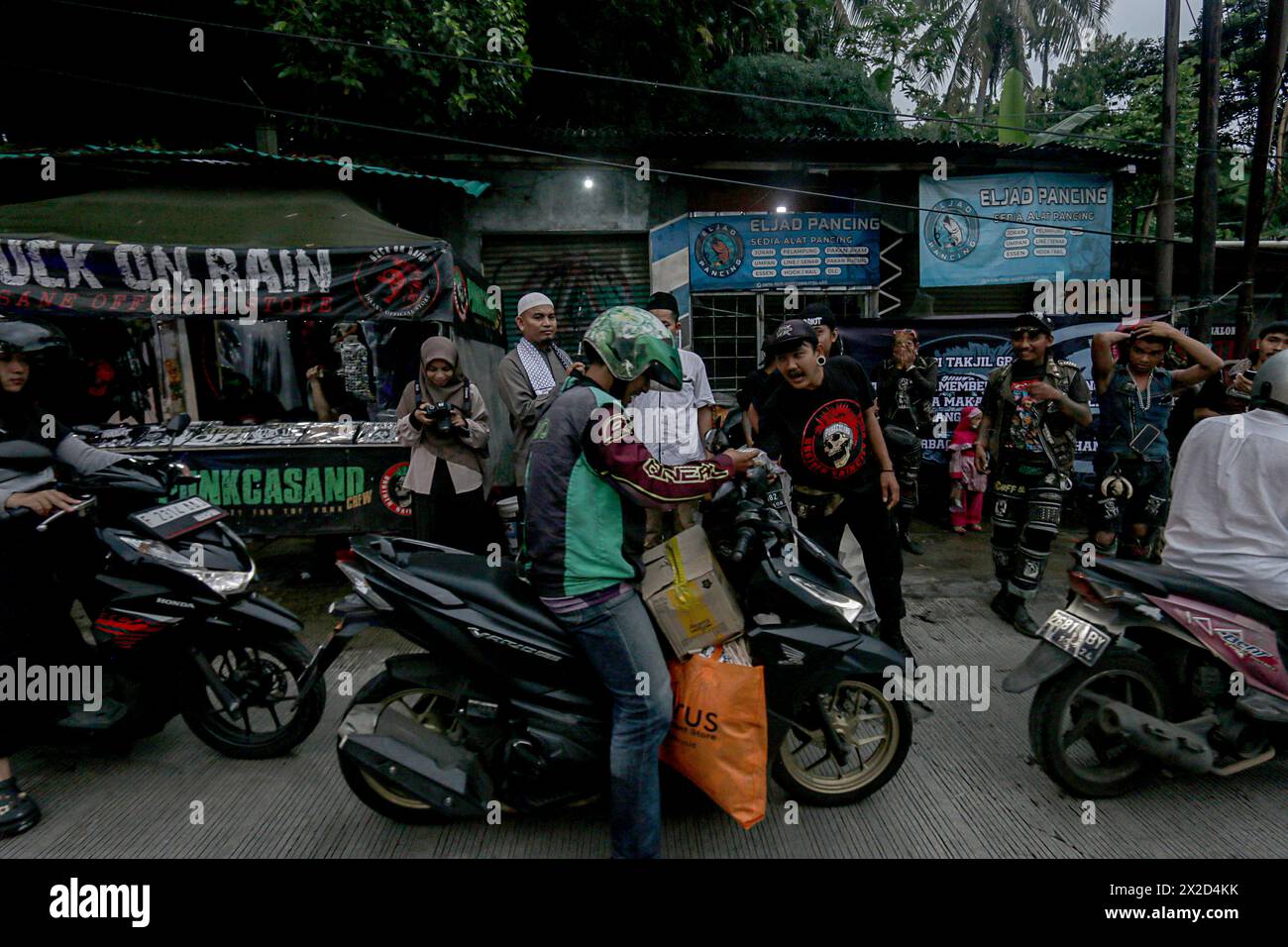 Members of the punk community in Bogor, West Java, Indonesia, give food ...