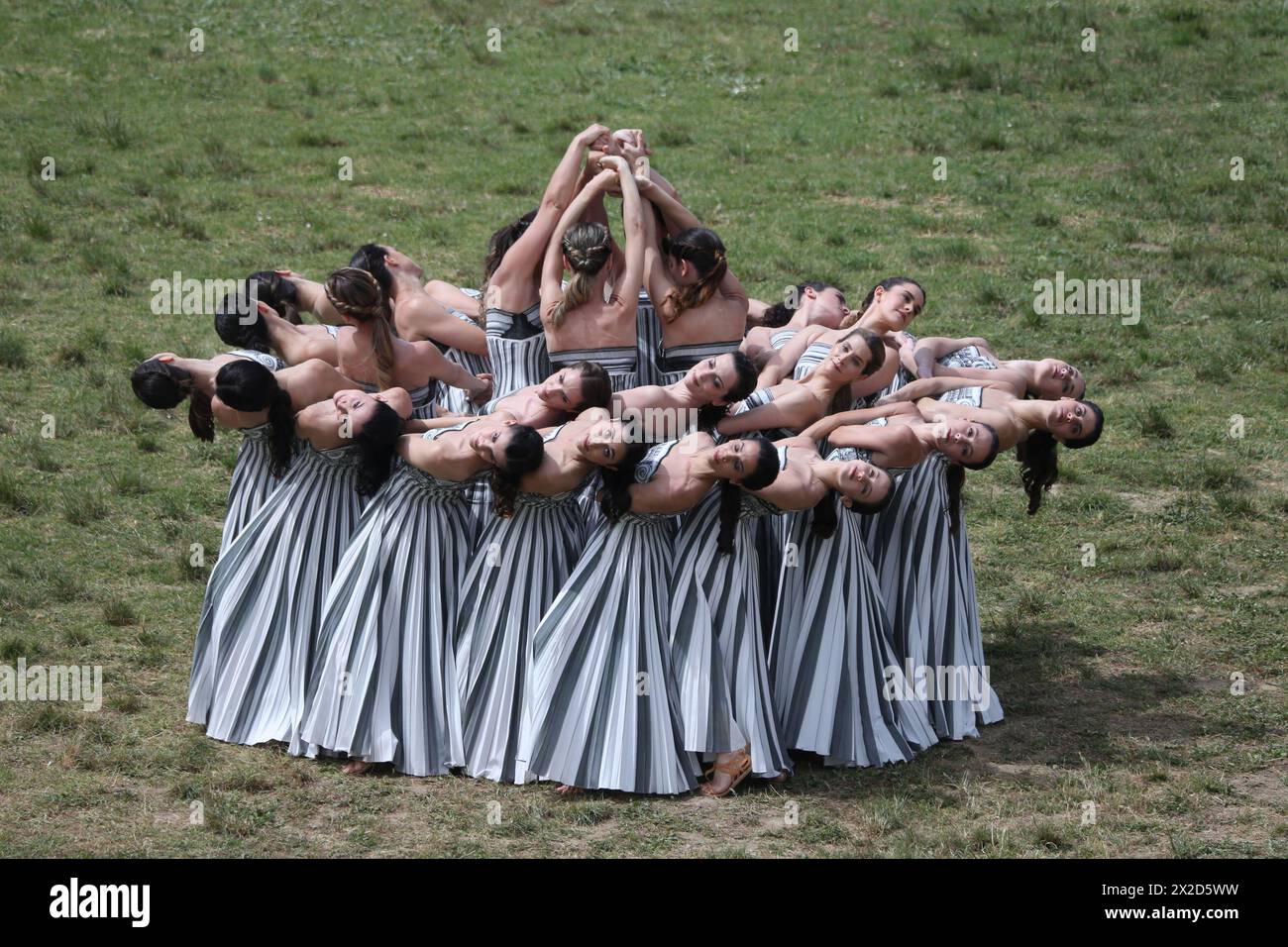 Performers take part in the official ceremony of the flame lighting for ...