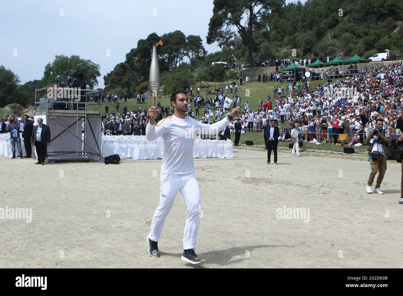 The first torch bearer, Greek olympic gold medalist Stefanos Douskos ...