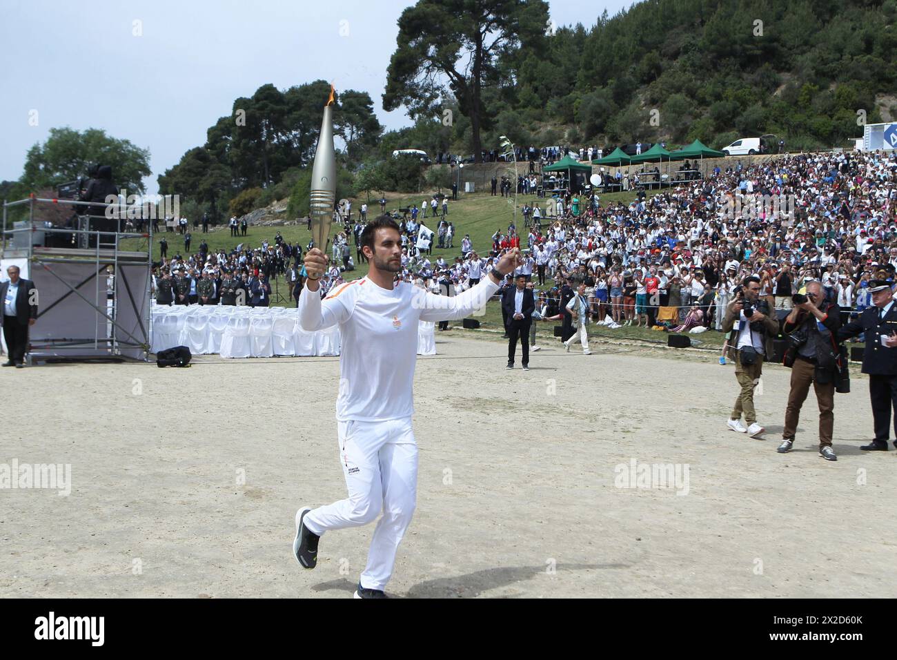 The first torch bearer, Greek olympic gold medalist Stefanos Douskos ...