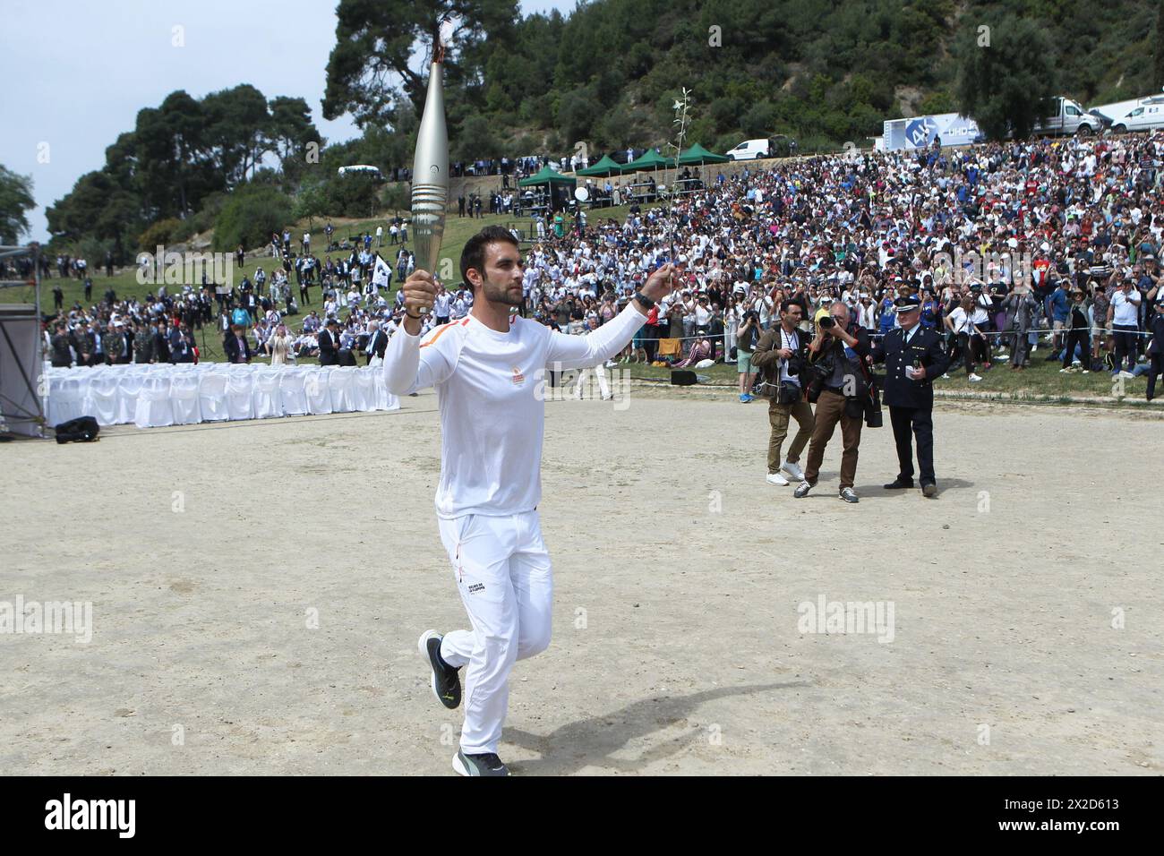The first torch bearer, Greek olympic gold medalist Stefanos Douskos ...