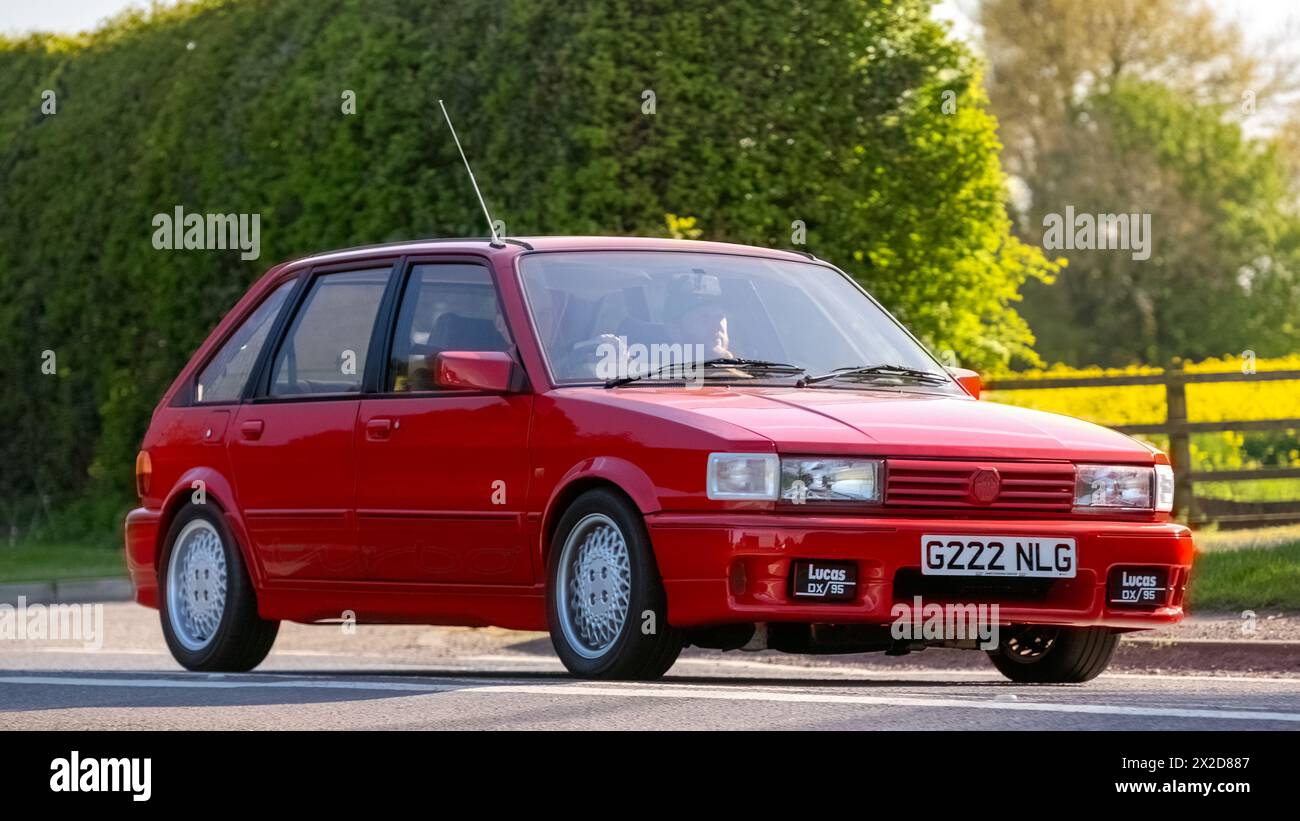 Bicester,UK- Apr 21st2024: 1989 red Rover Maestro classic car driving ...