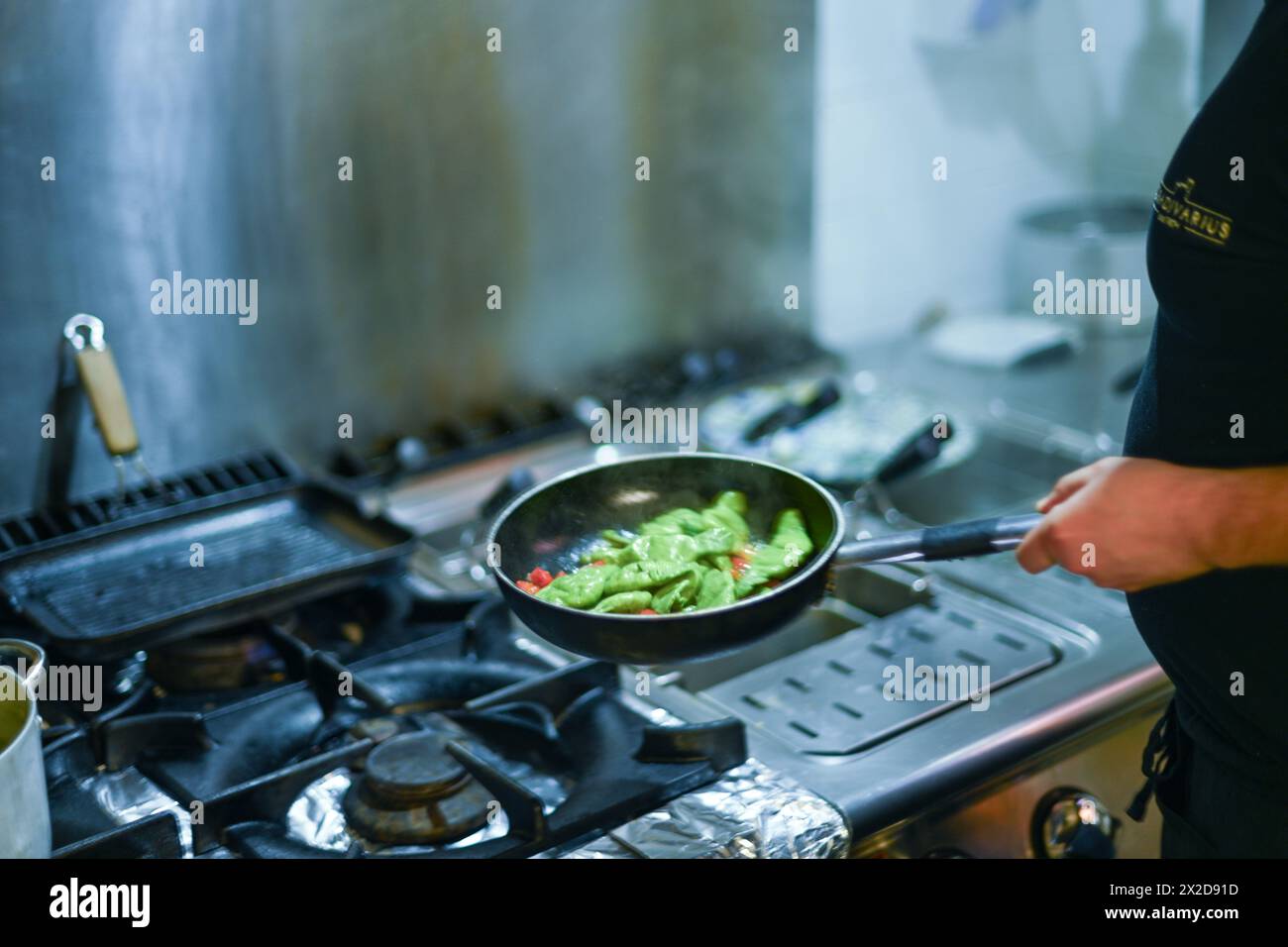 Adding oil pan cooking pasta hi-res stock photography and images - Alamy