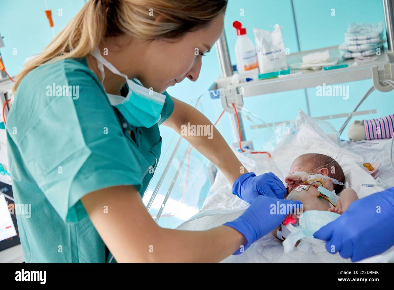Team of doctors and nurses attending to a baby, Neonatal pediatrics ...