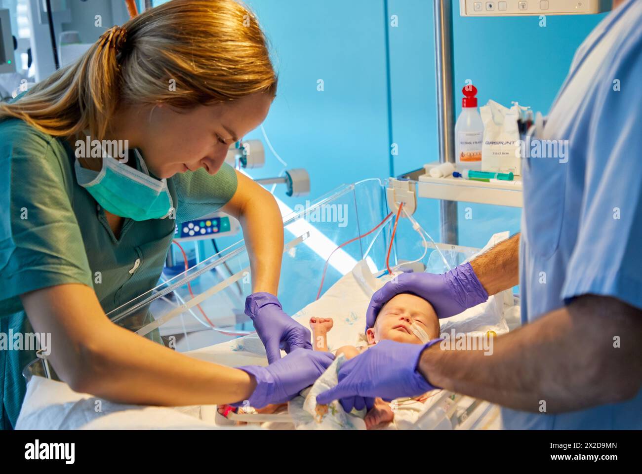 Team of doctors and nurses attending to a baby, Neonatal pediatrics ...