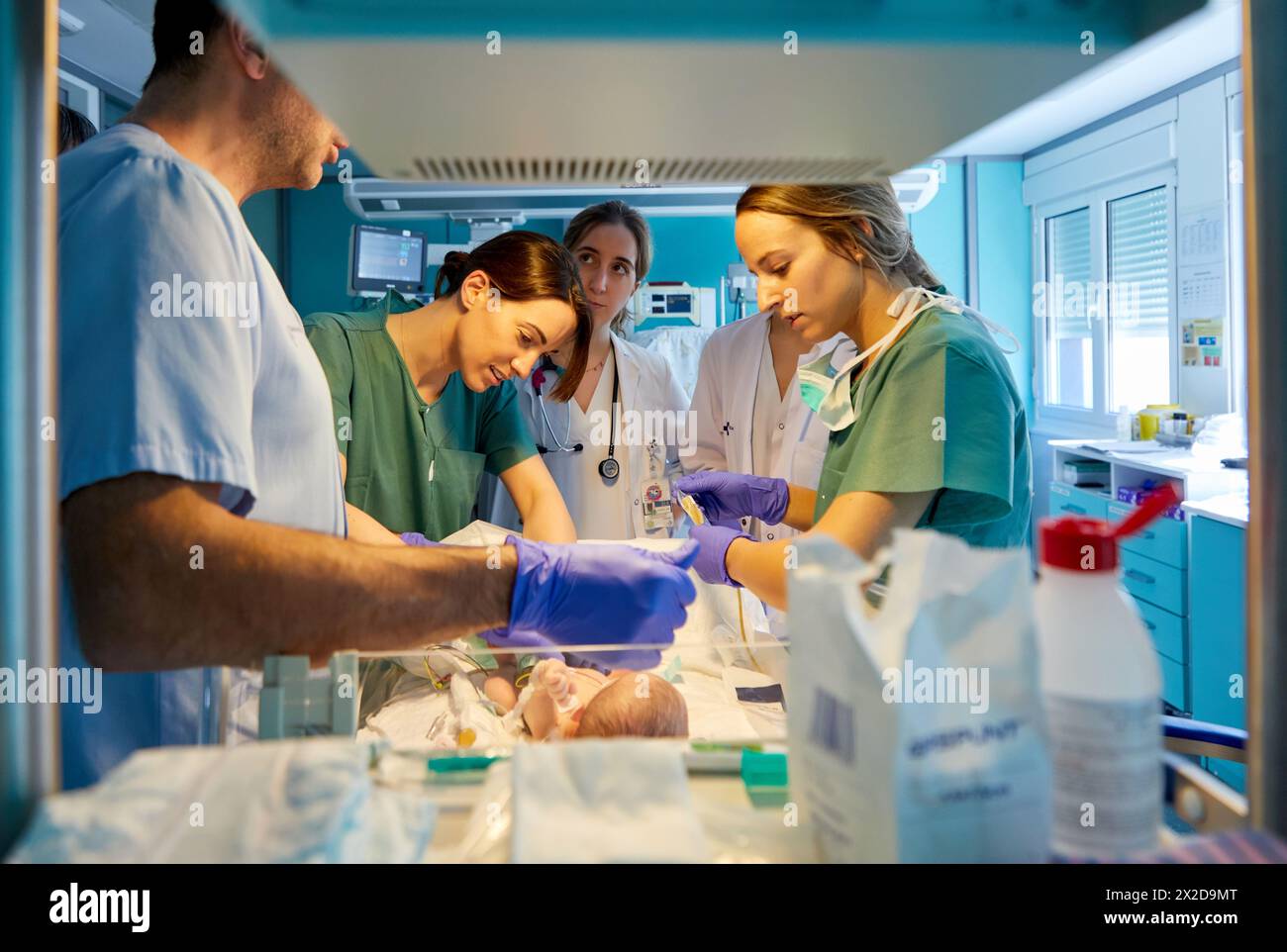 Team of doctors and nurses attending to a baby, Neonatal pediatrics ...