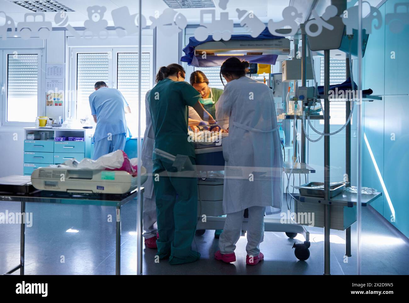 Team of doctors and nurses attending to a baby, Neonatal pediatrics ...