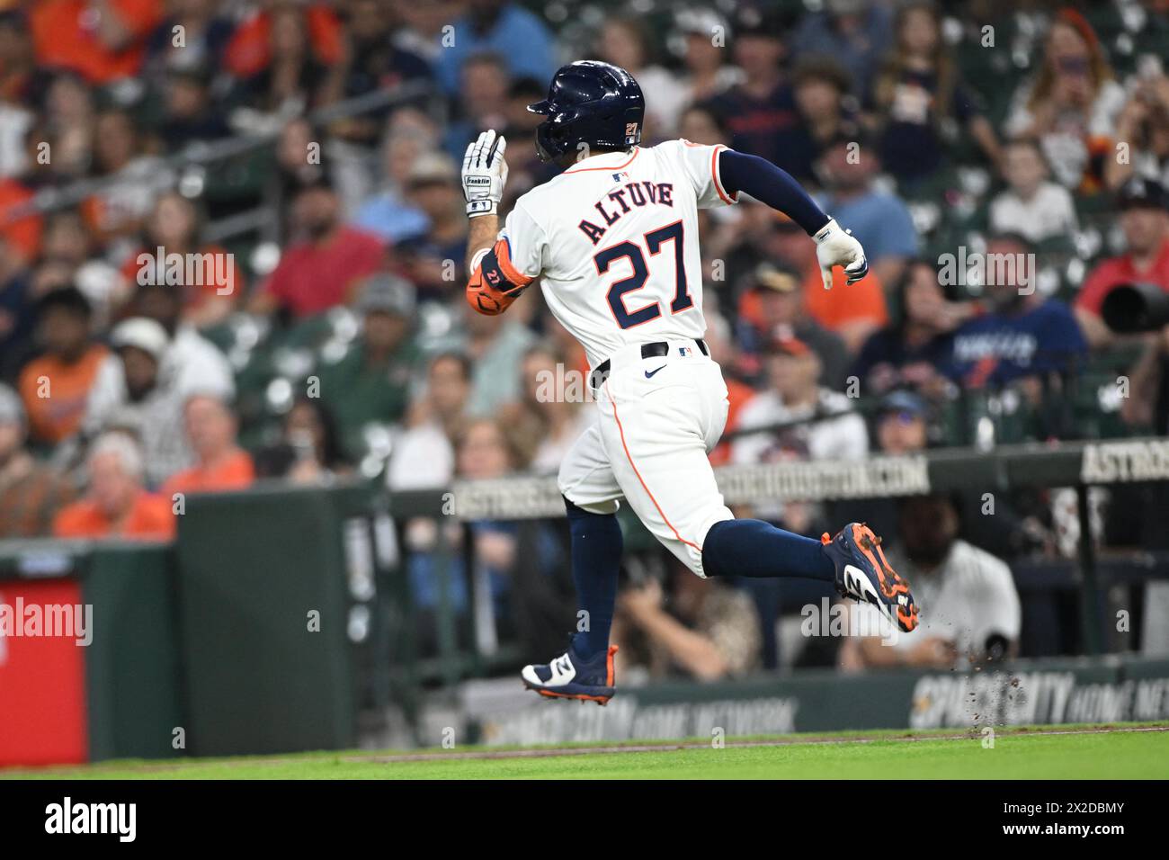 Houston Astros second base Jose Altuve (27) runs to first base during the MLB baseball game ...