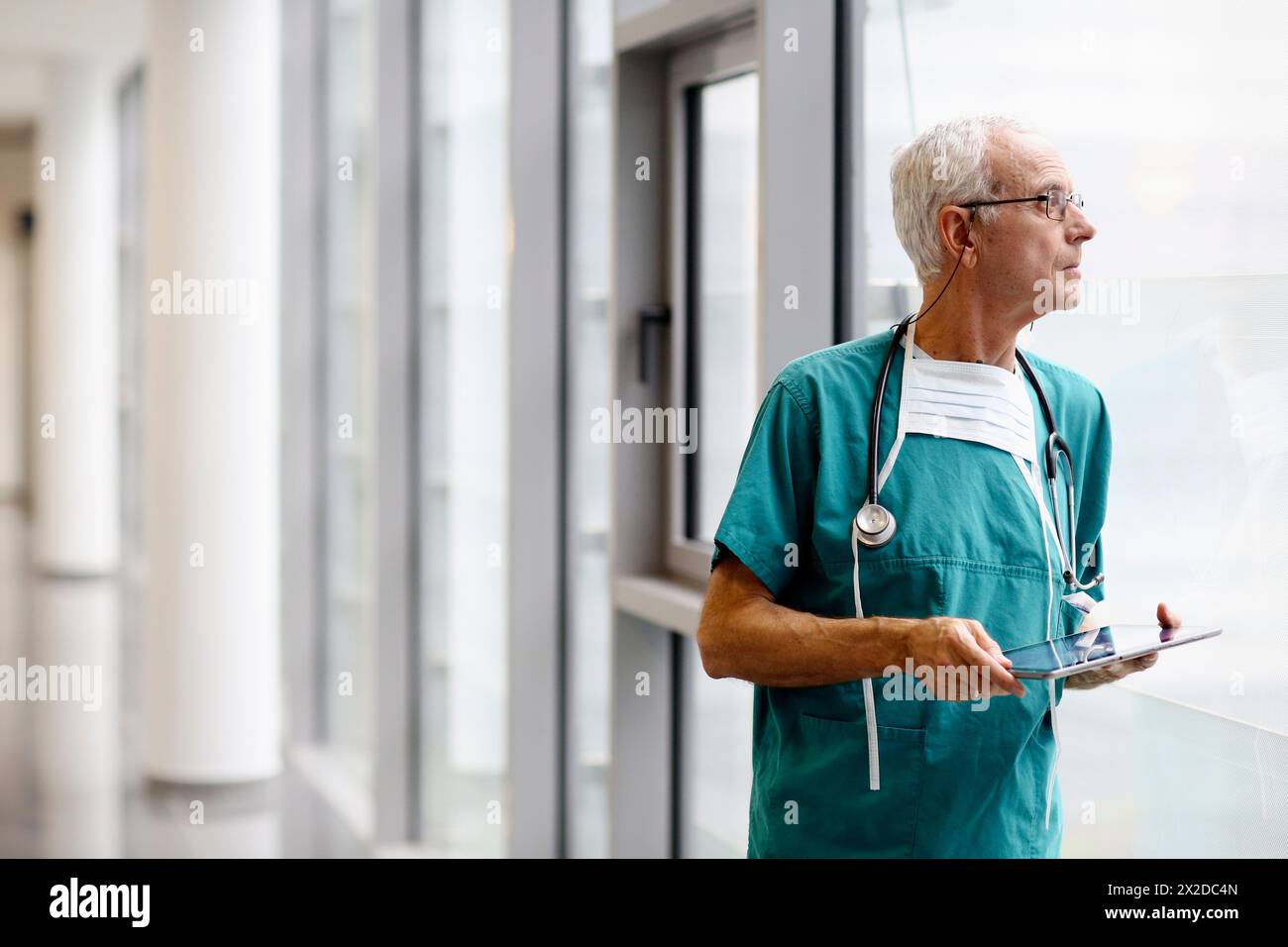 surgeon with tablet in the operating room hallway, Onkologikoa Hospital ...