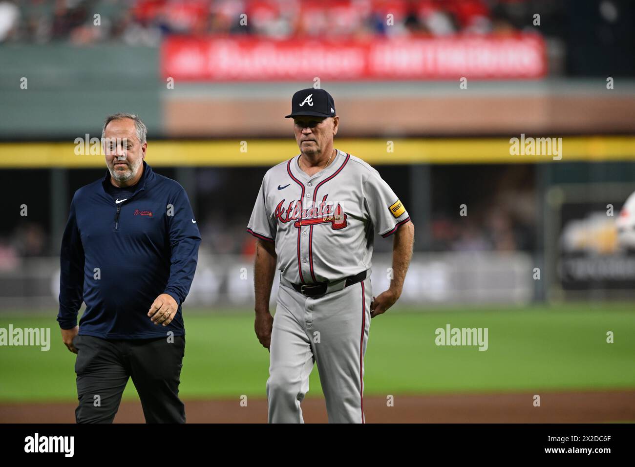 Atlanta Braves manager Brian Snitker (43) returns from checking on outfielder Ronald Acu–a Jr ...