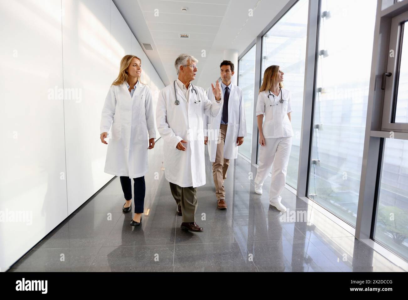 Doctors and nurses walking in corridor, Onkologikoa Hospital, Oncology ...
