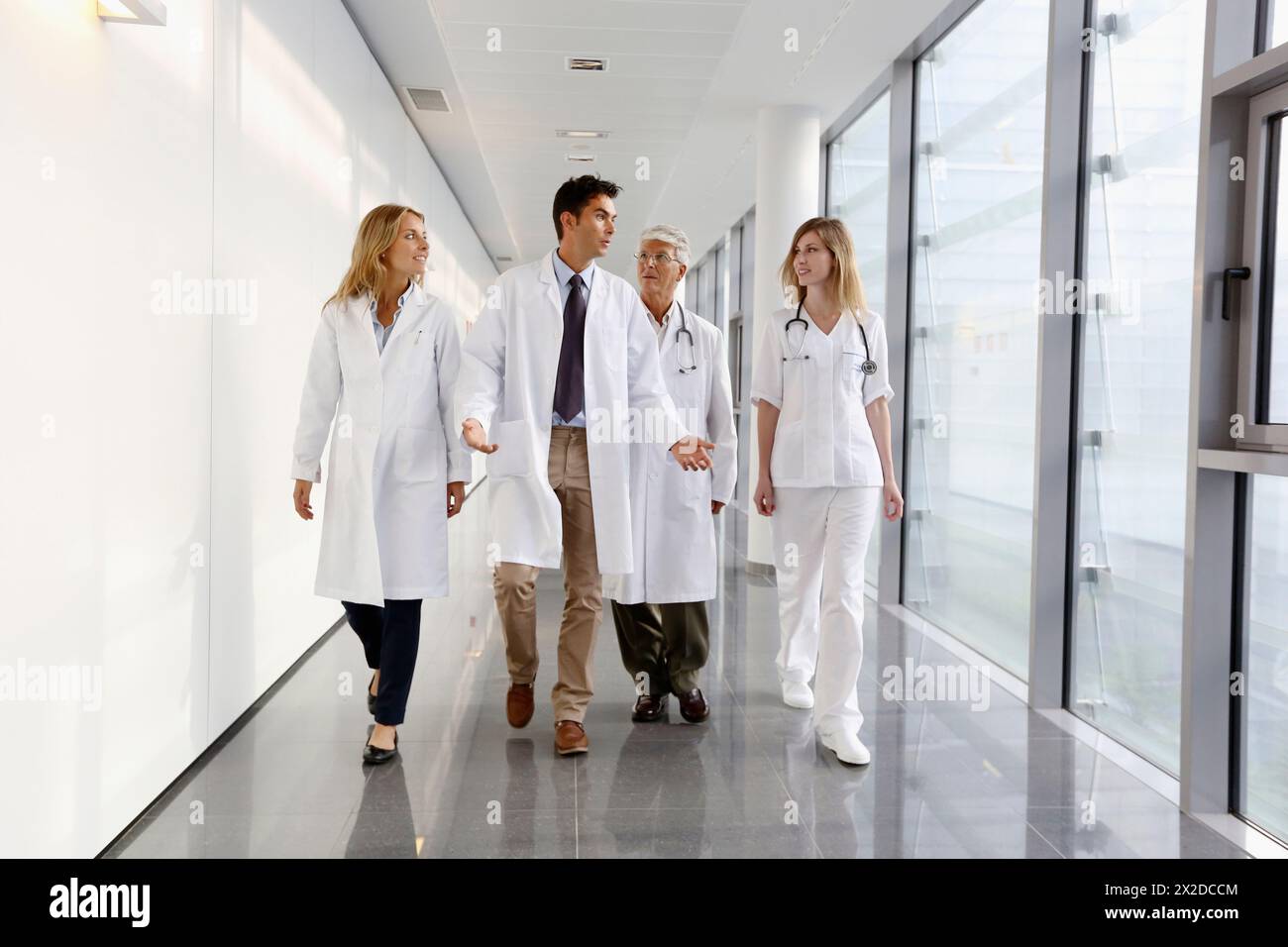 Doctors and nurses walking in corridor, Onkologikoa Hospital, Oncology ...
