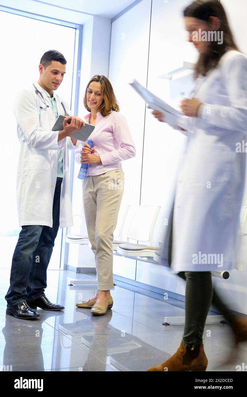 Doctor with patient in waiting room, Onkologikoa Hospital, Oncology ...