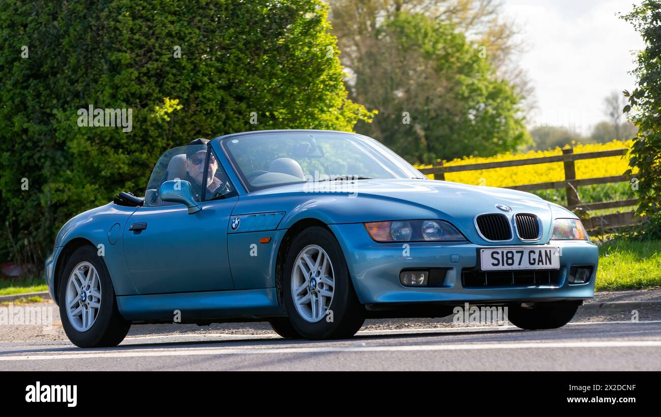 Bicester,UK- Apr 21st2024: 1998 blue BMW Z3 classic car driving on a ...