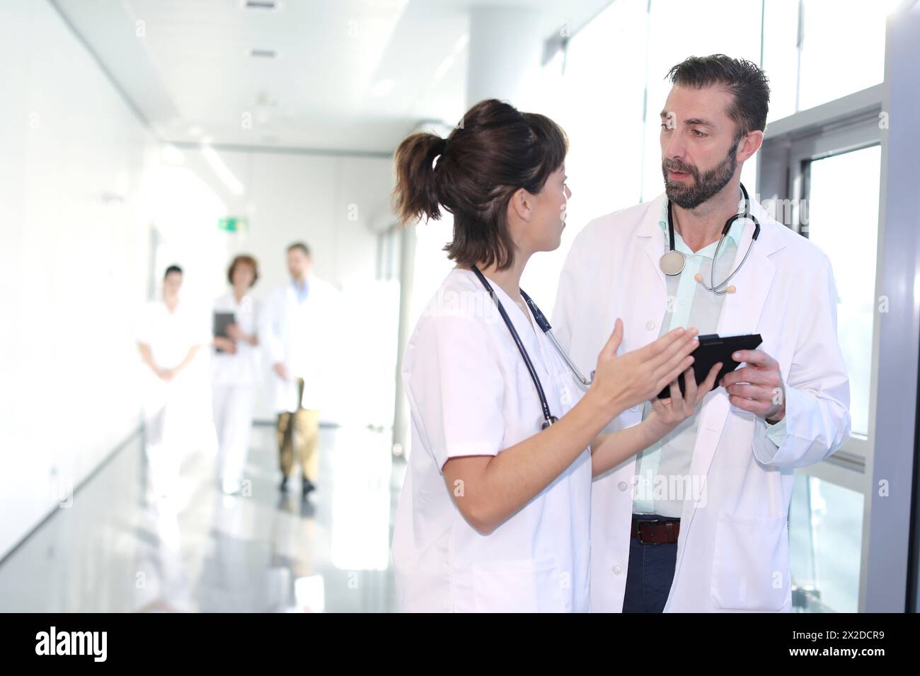 Doctors and nurses talking in corridor, Hospital, Spain Stock Photo - Alamy