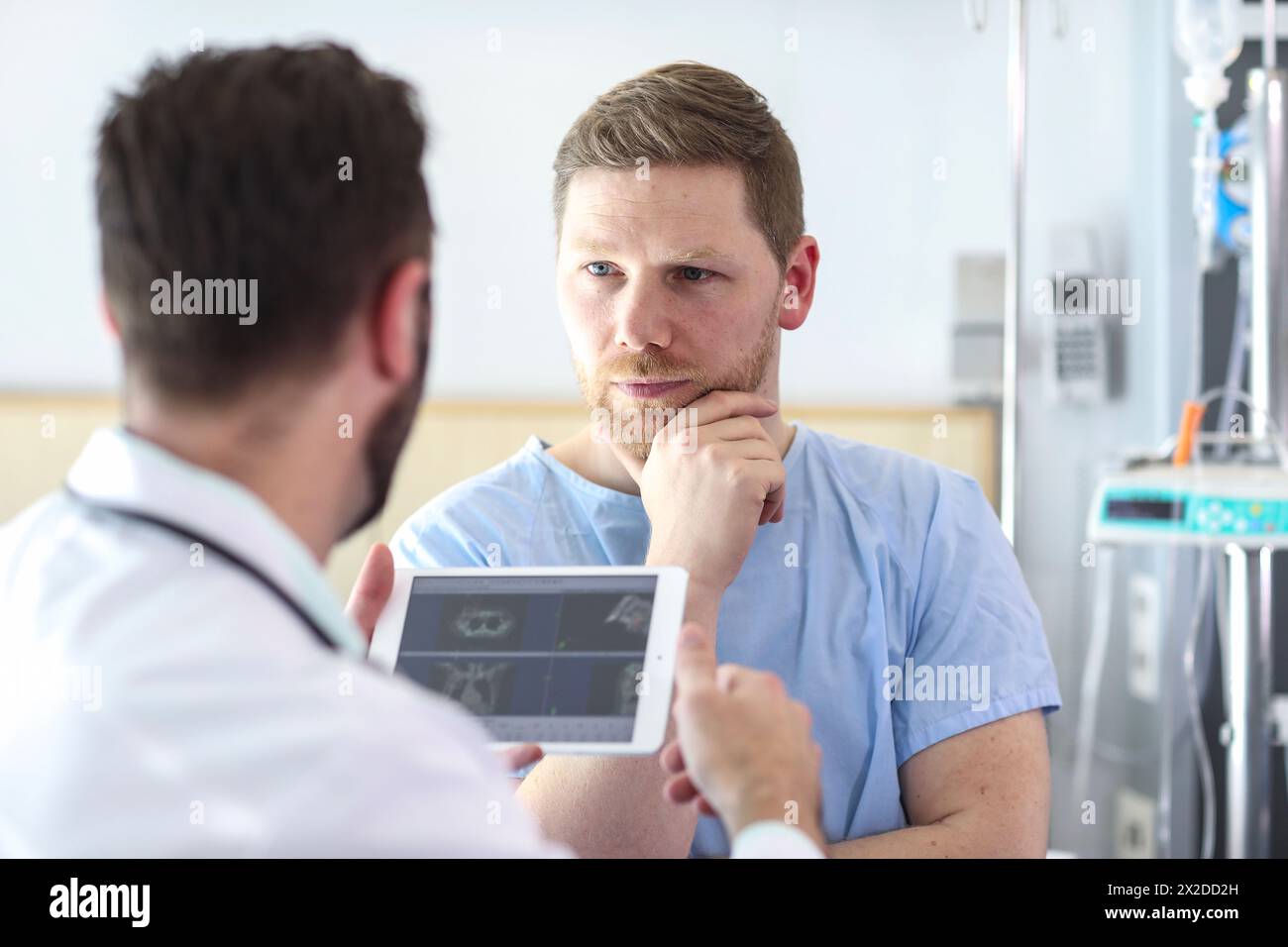 Patient in hospital room attended by a doctor, Tablet, Hospital Stock ...