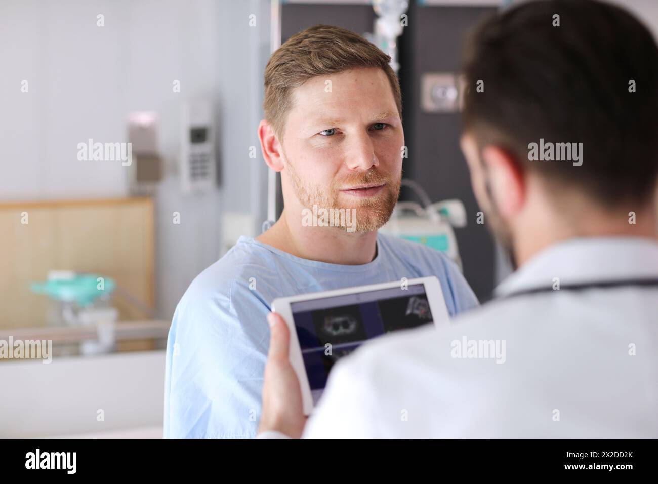 Patient in hospital room attended by a doctor, Tablet, Hospital Stock ...
